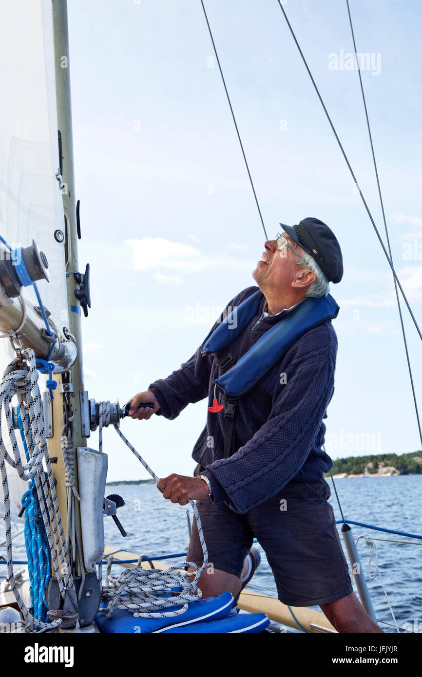 Senior man sailing Stock Photo - Alamy