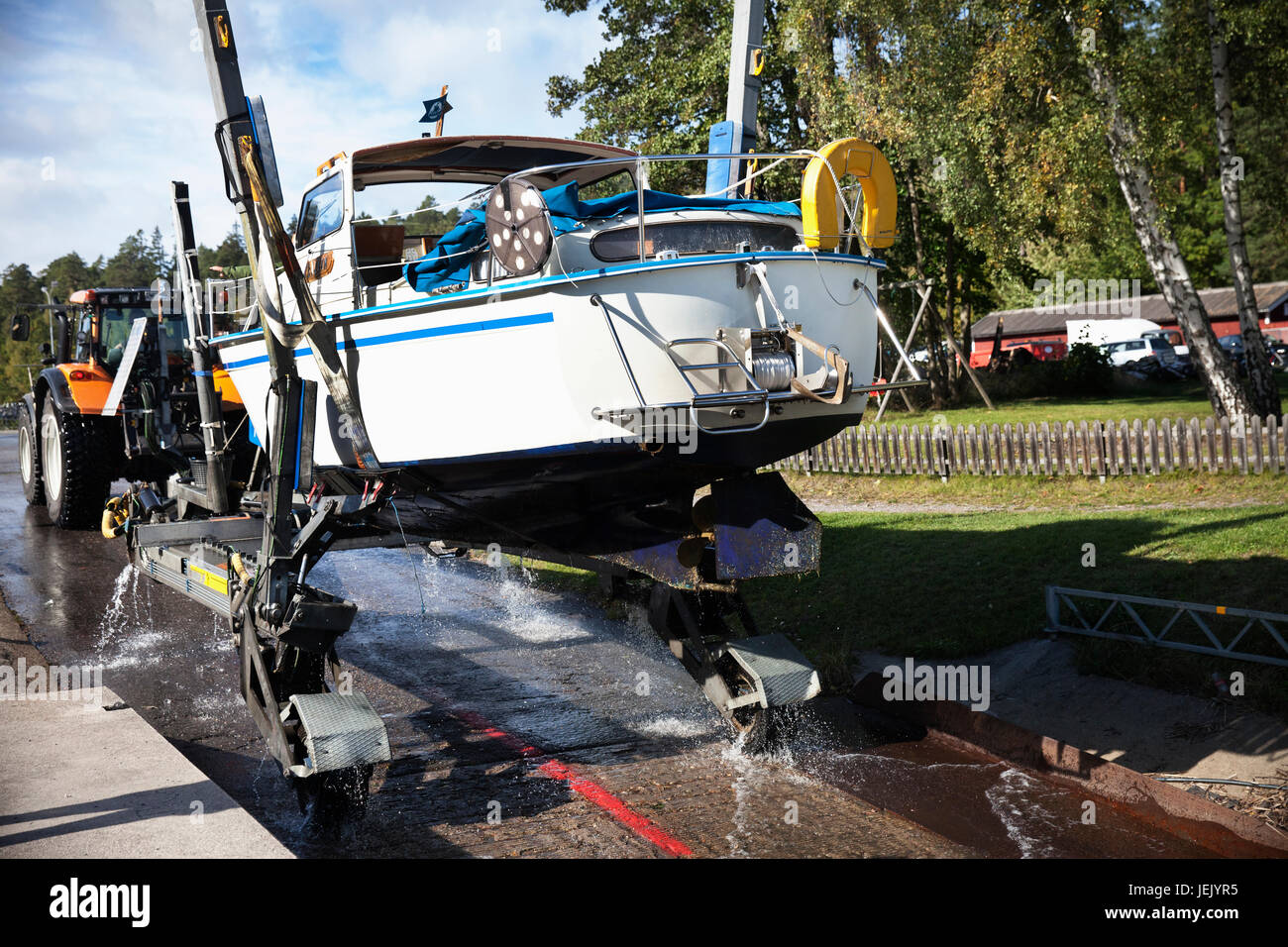 Tractor pulling boat Stock Photo - Alamy