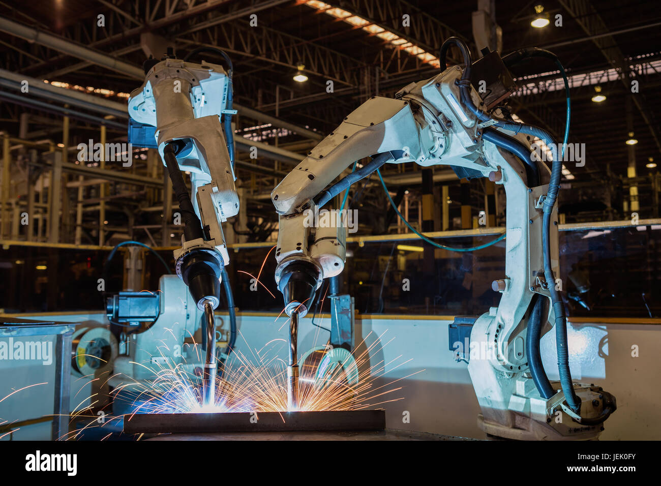 Team robot are welding in car factory Stock Photo - Alamy