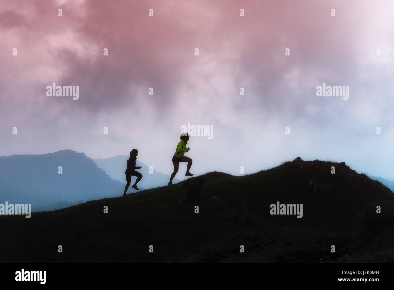 Mountain racing training of two girls Stock Photo - Alamy