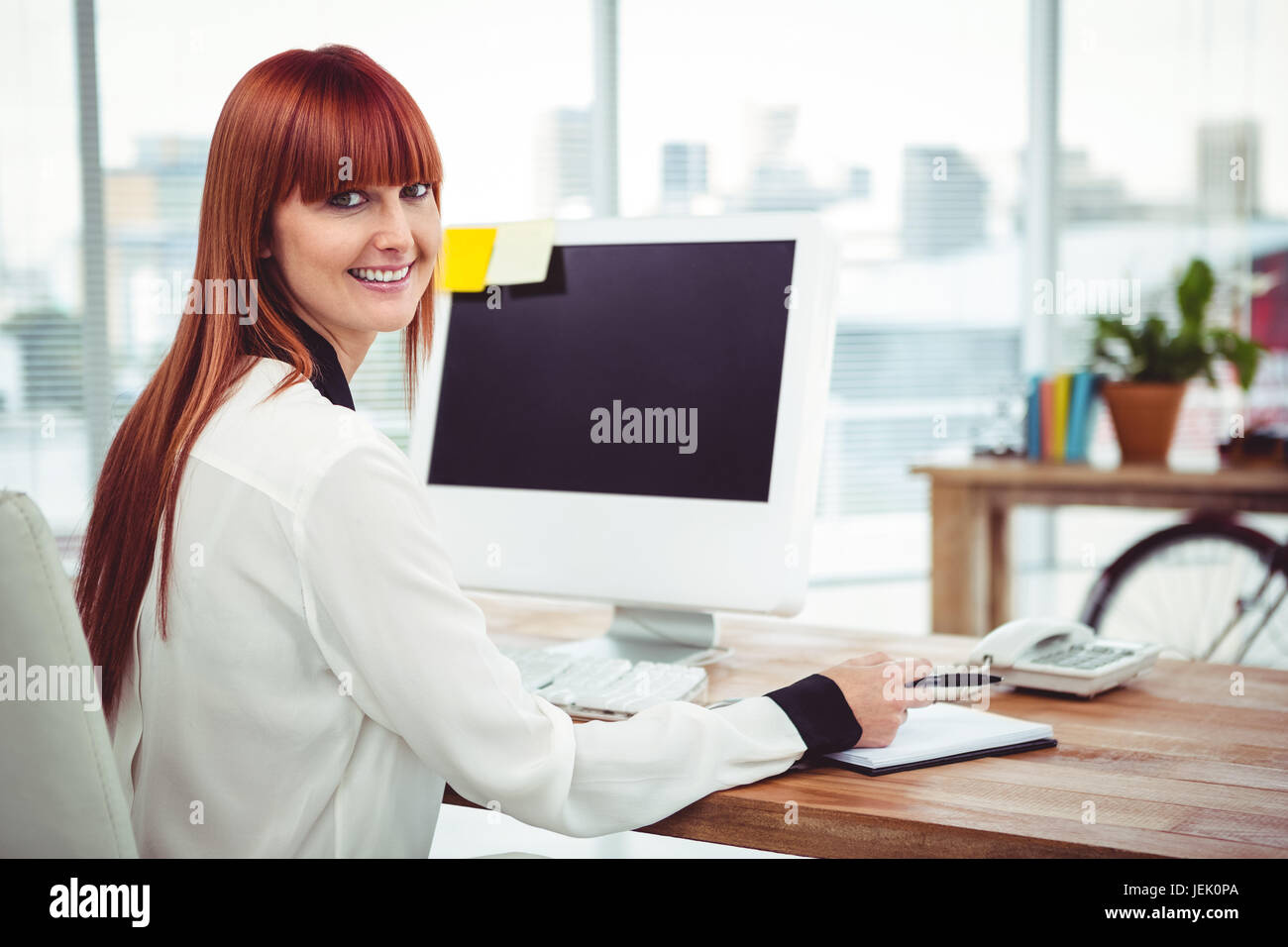 Hipster businesswoman using her computer Stock Photo - Alamy