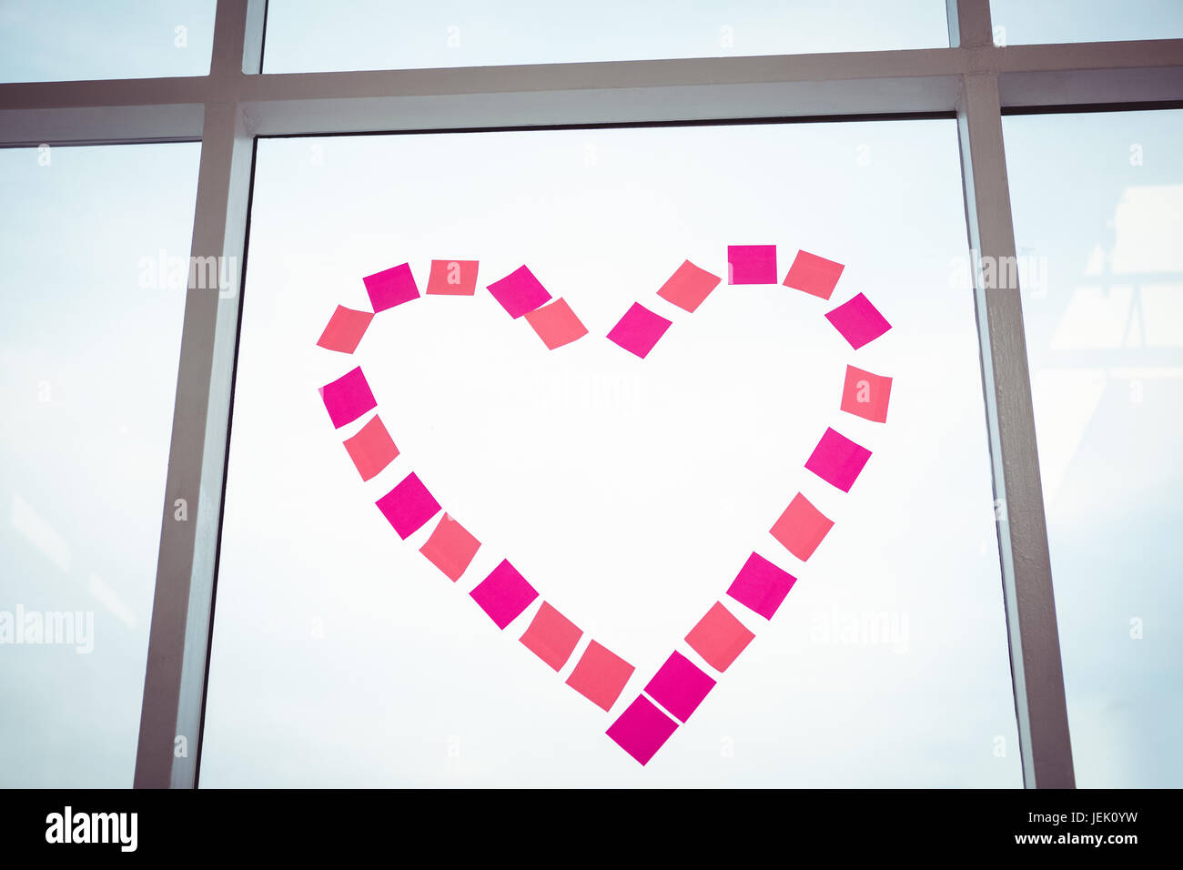 Heart in post-it on a window Stock Photo - Alamy