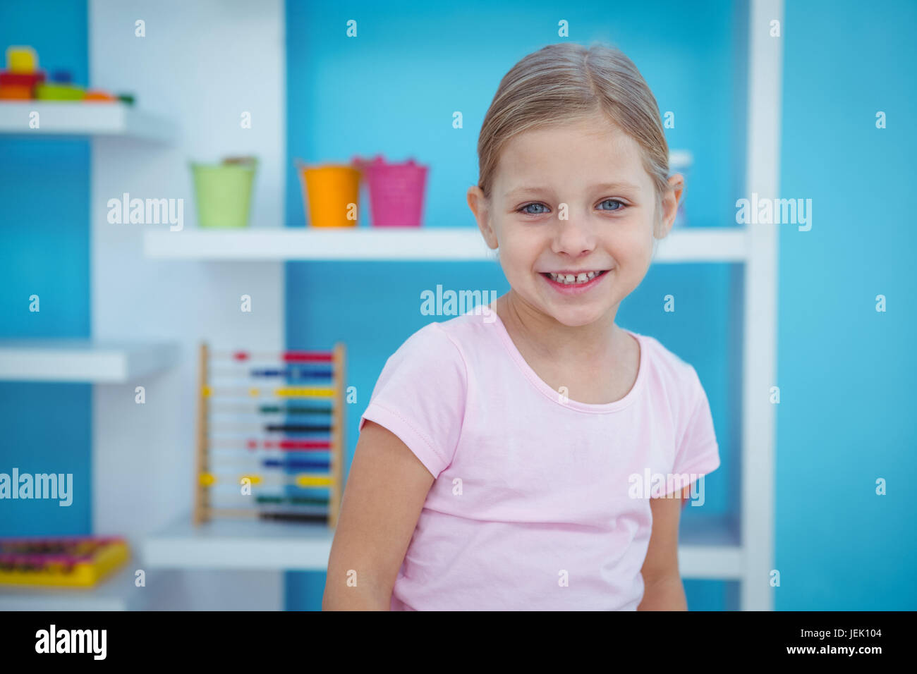 Cute girl smiling at camera Stock Photo - Alamy