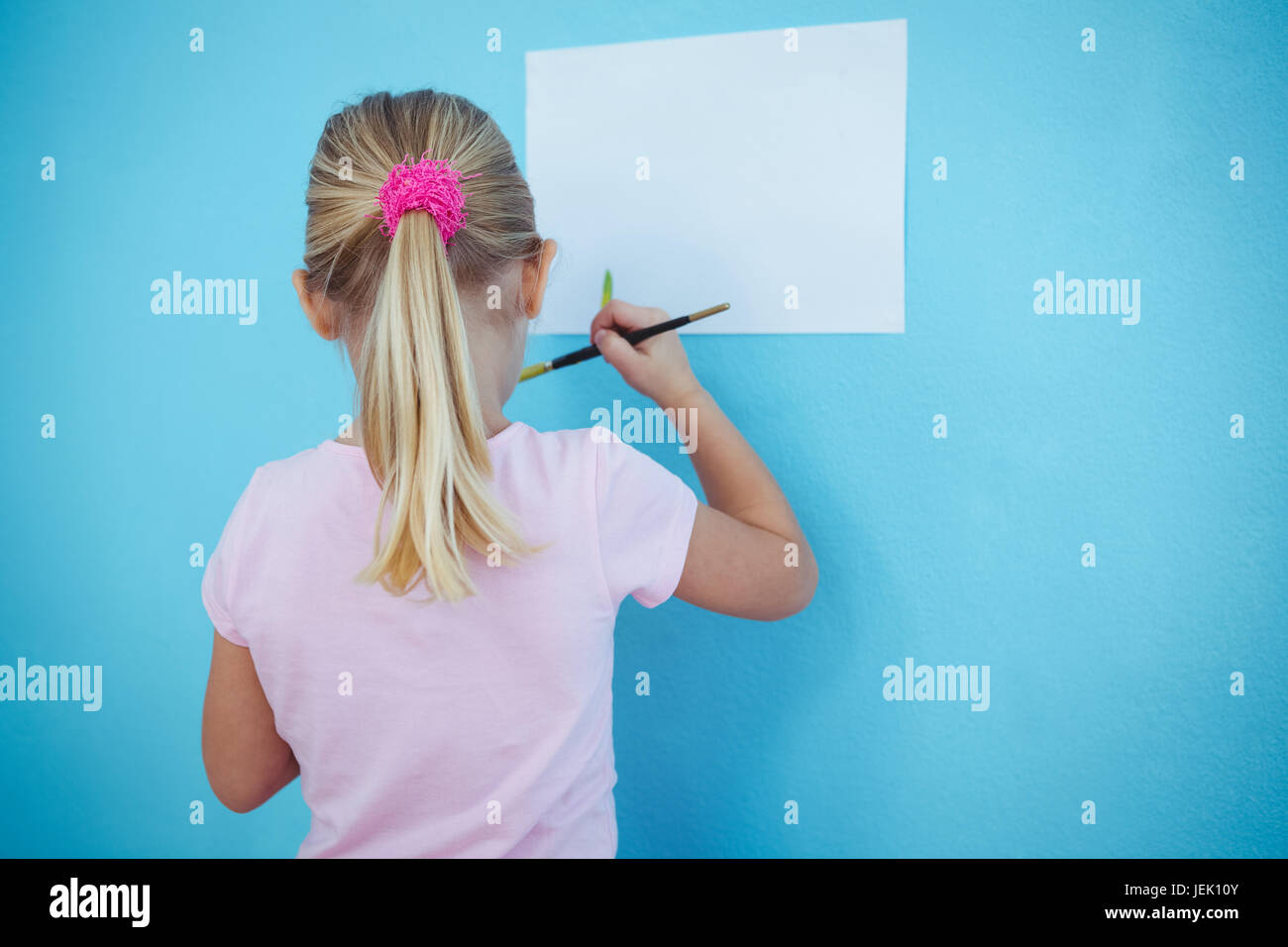 Cute girl painting Stock Photo - Alamy