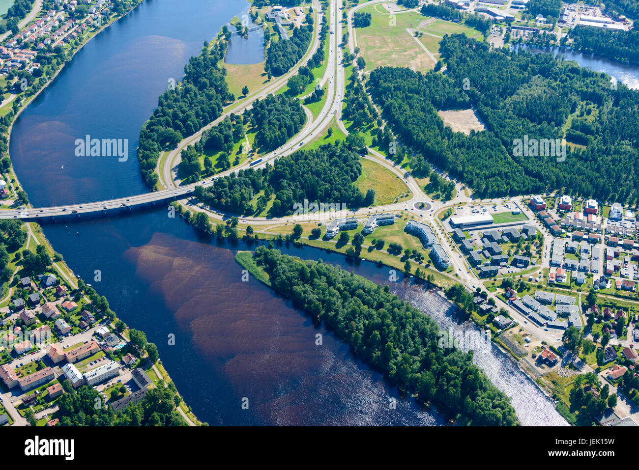 Aerial view of river flowing through city Stock Photo - Alamy