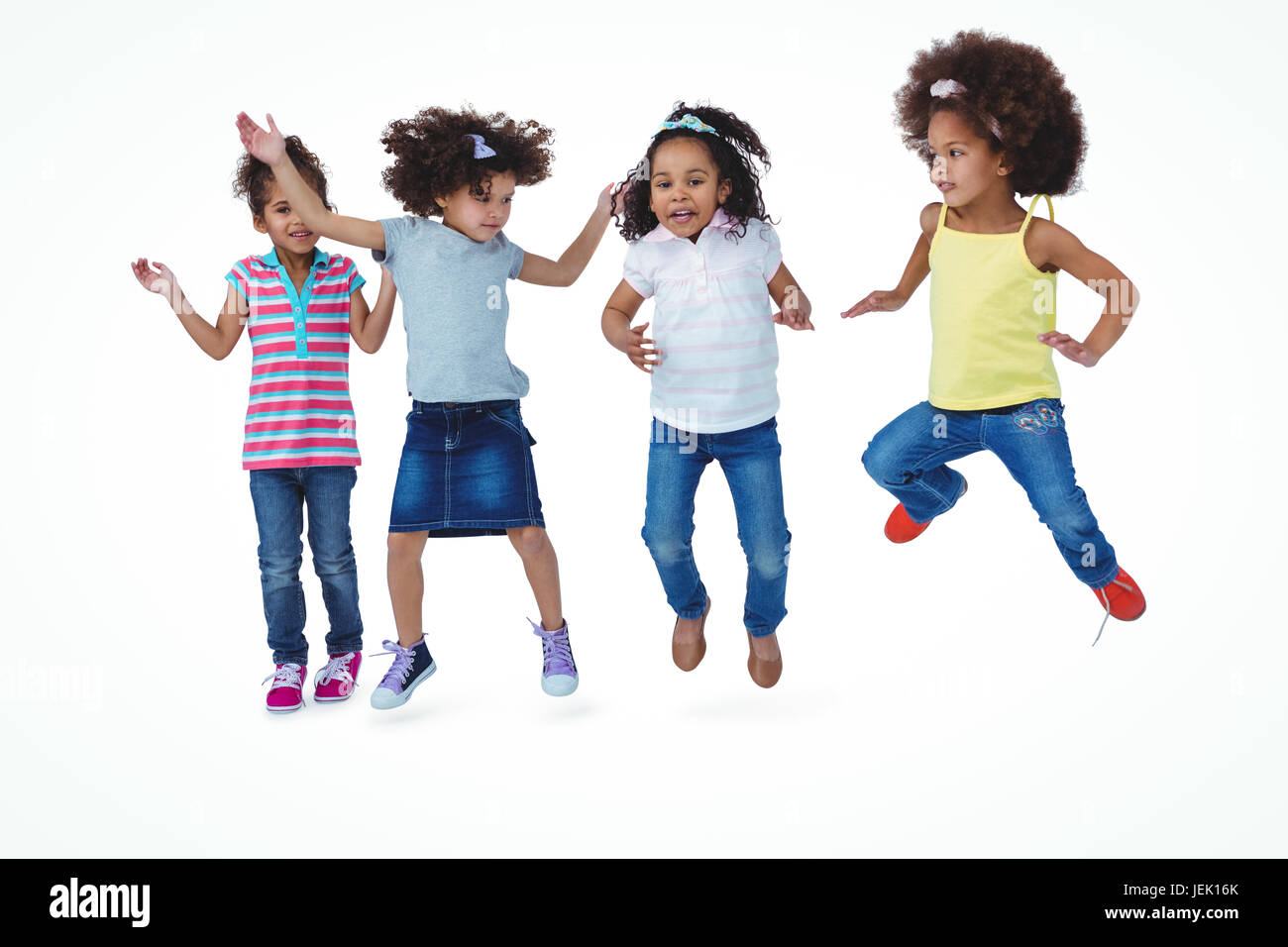 Cute girls jumping Stock Photo - Alamy