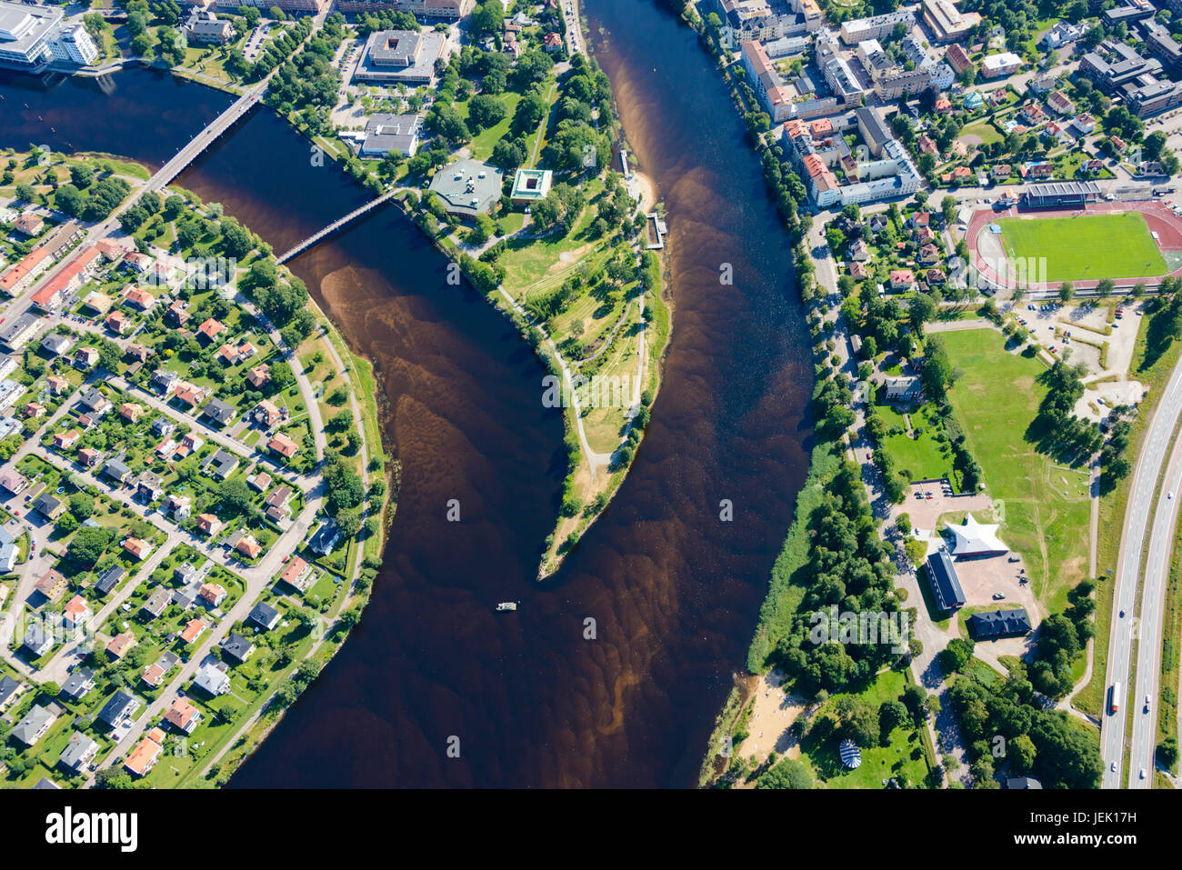 Aerial view of river flowing through city Stock Photo - Alamy