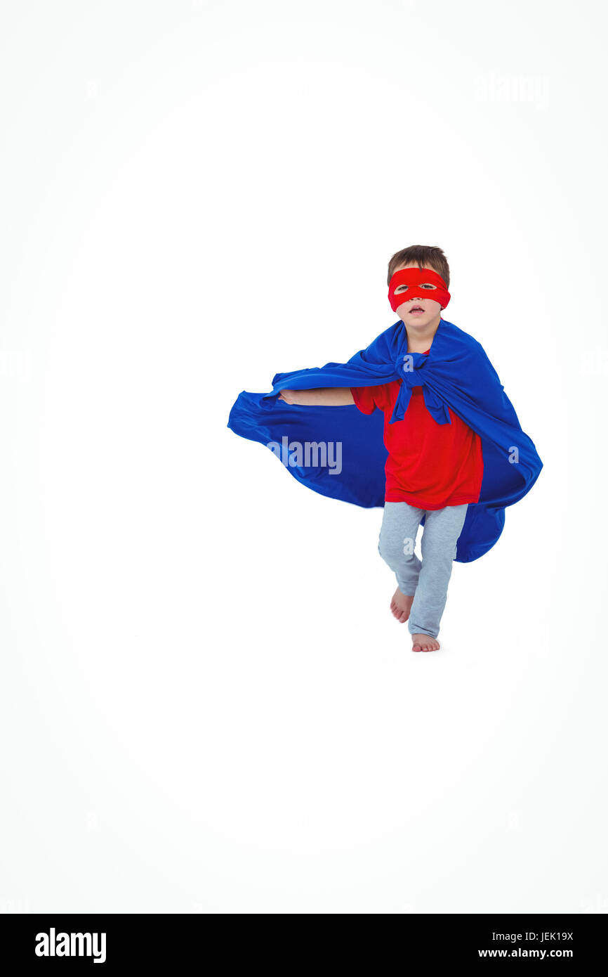 Masked boy running pretending to be superhero Stock Photo - Alamy