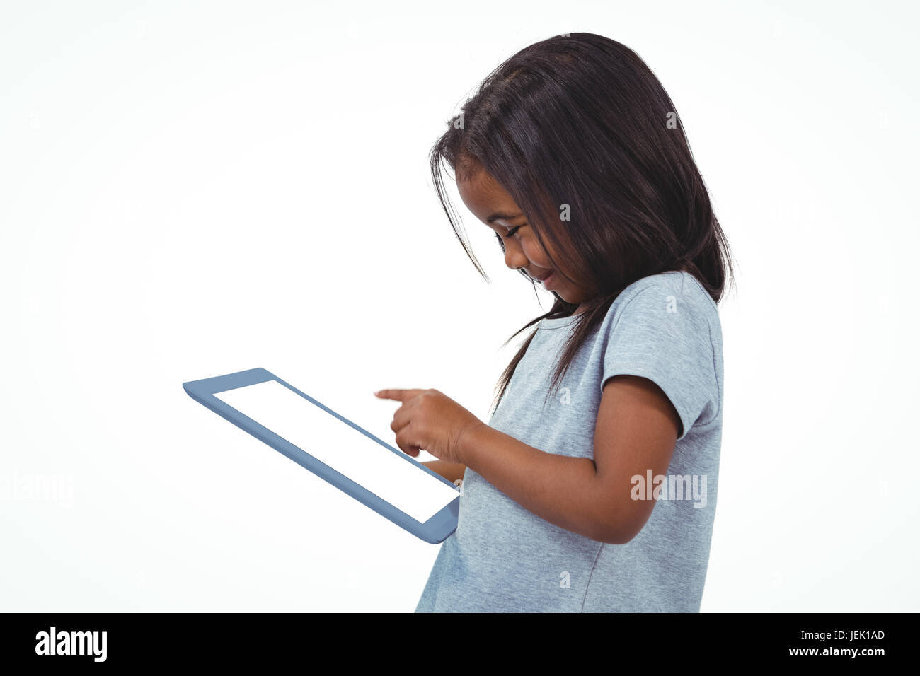 Standing girl using tablet Stock Photo - Alamy