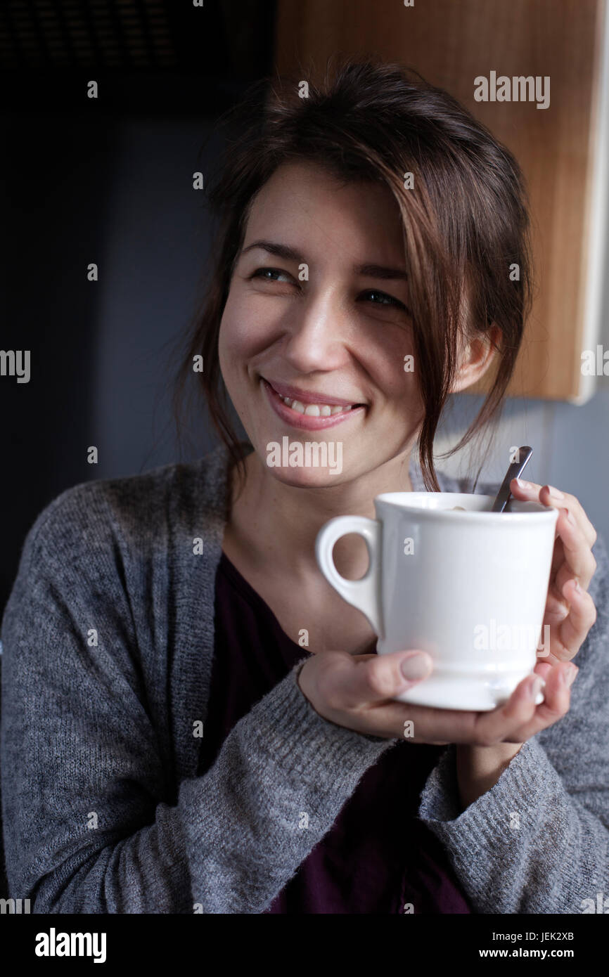 Young woman with mug Stock Photo - Alamy