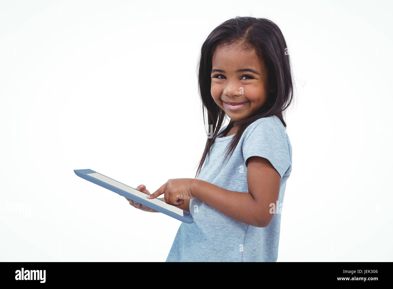 Standing girl using tablet and smiling at camera Stock Photo - Alamy