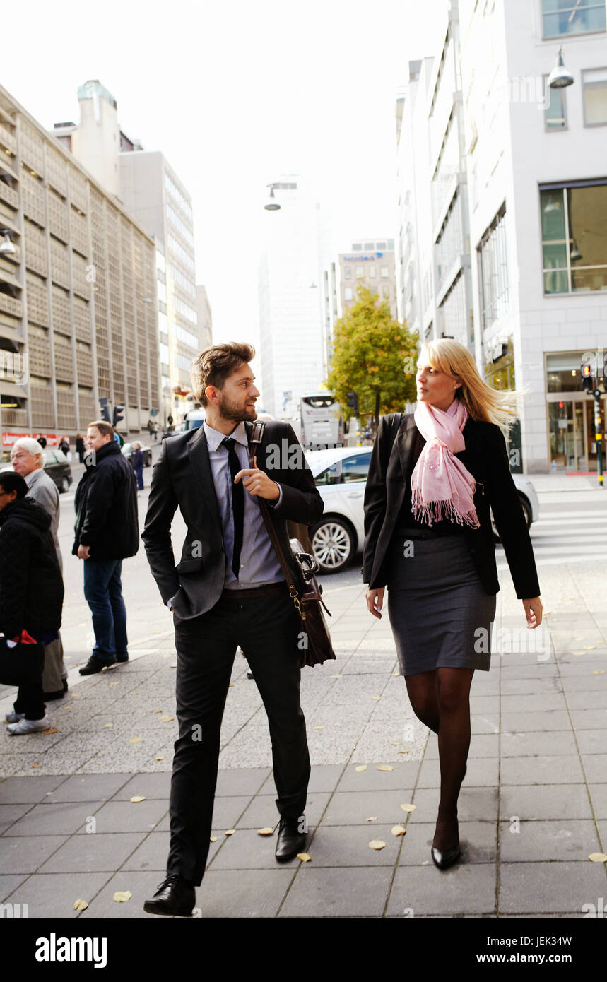 Business people walking Stock Photo - Alamy