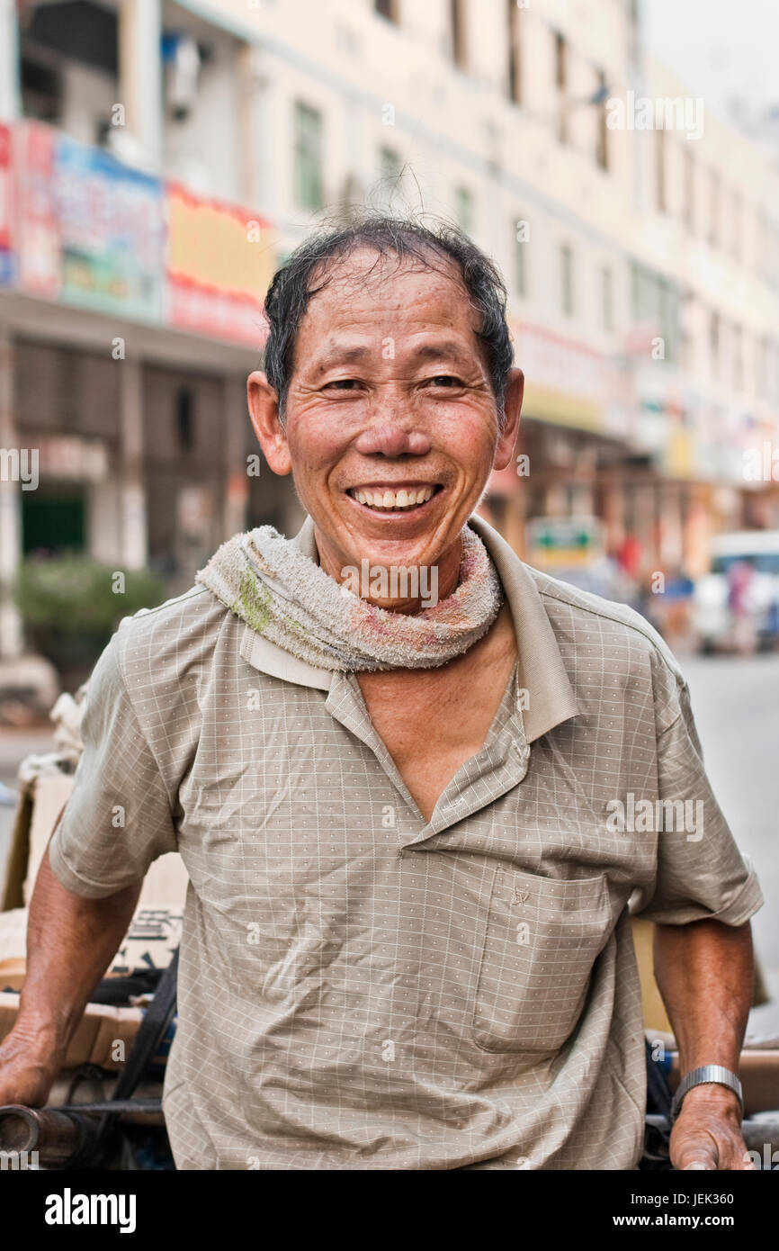 Cheerful worker on the street in Shenzhen China isn’t the cheap labor ...