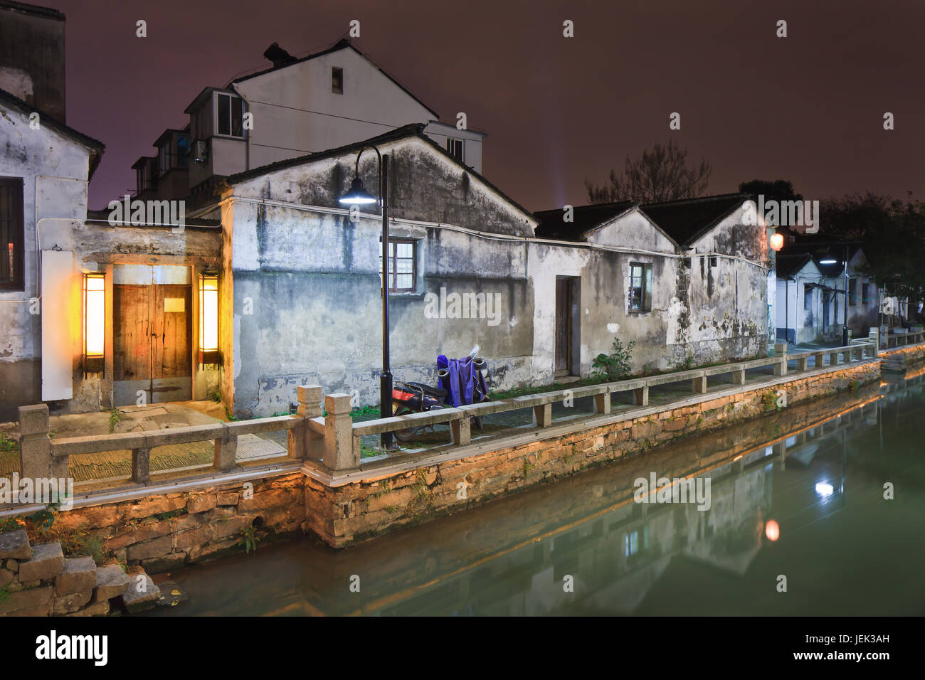 Waterway in traditional neighborhood at night, Suzhou, China Stock ...