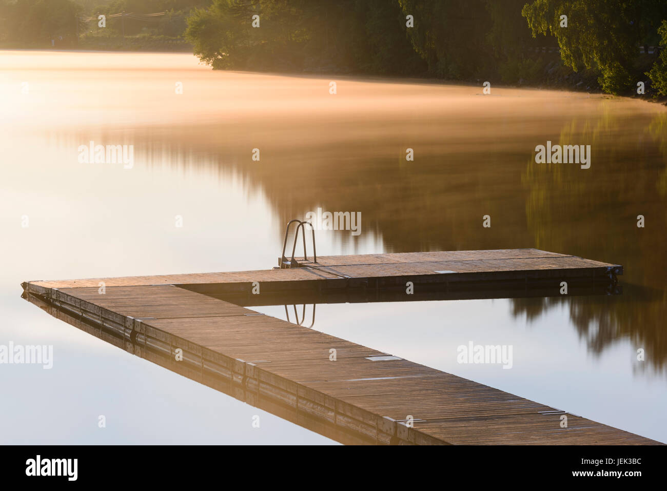 Jetty with swimming ladder Stock Photo - Alamy