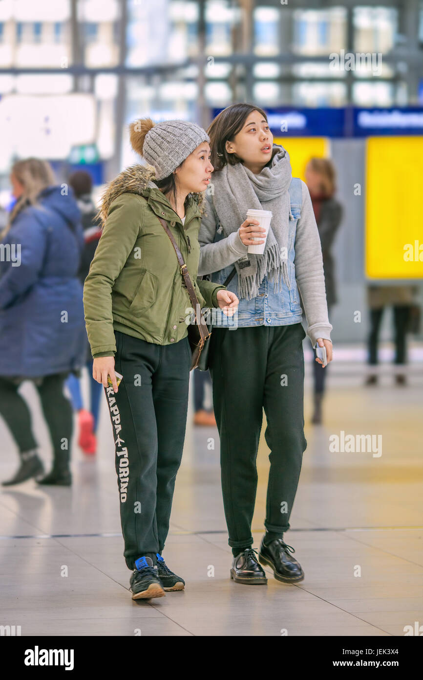 UTRECHT-MARCH 2, 2017. Asian girls looking at info screen at Utrecht ...