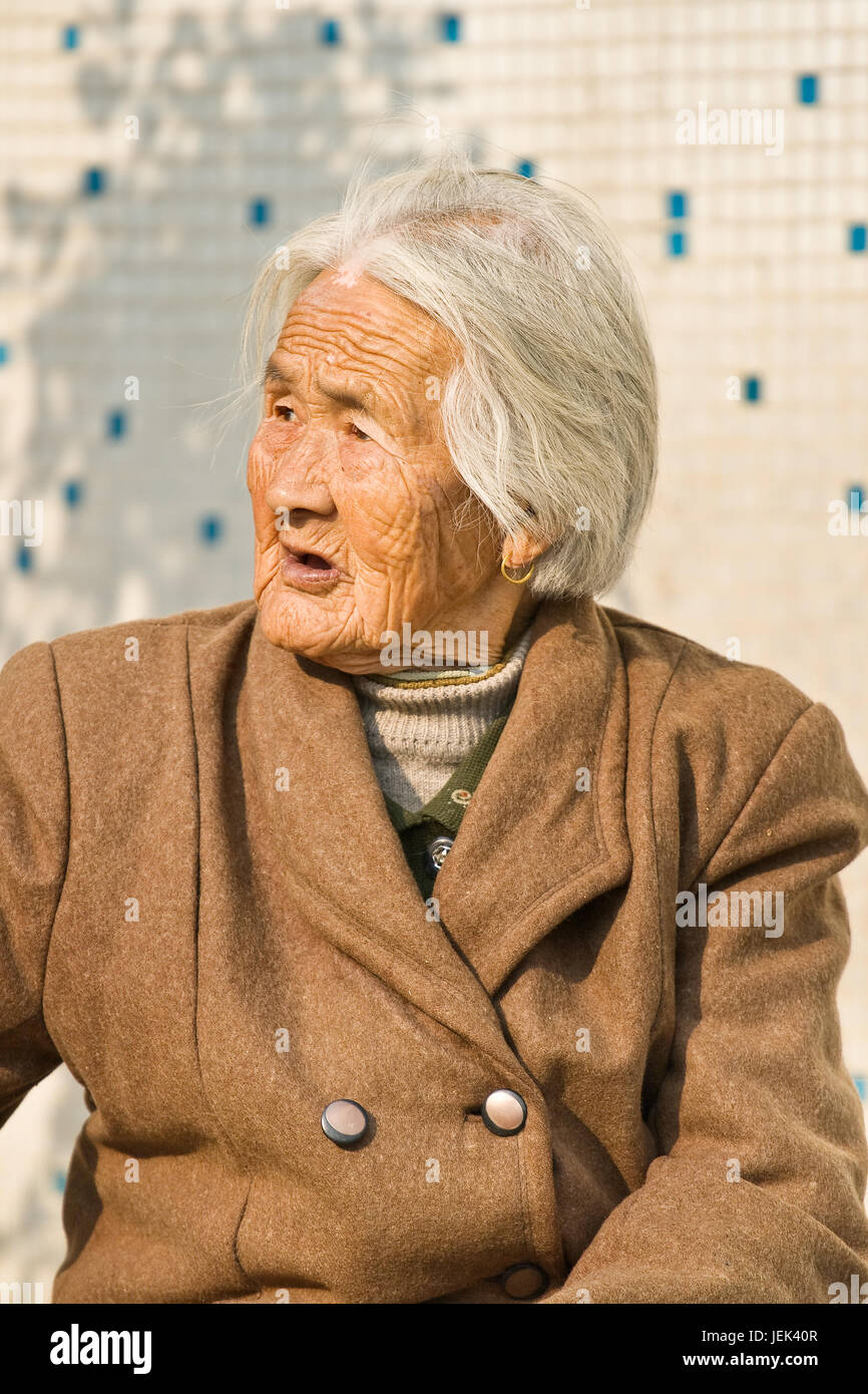 BEIJING–NOV. 30, 2006. Old Chinese lady with white hair. China’s ...