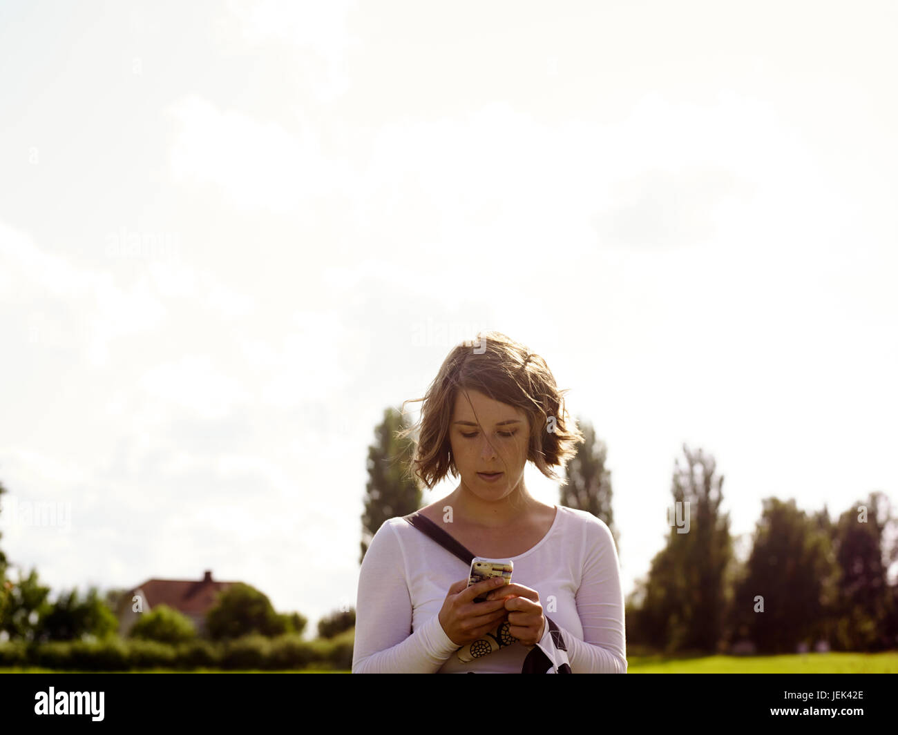 Back view woman phone green hi-res stock photography and images - Alamy