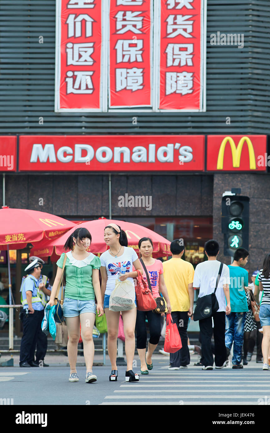 XIANG YANG-CHINA-JULY 3. Pedestrians in front of McDonald outlet. It ...
