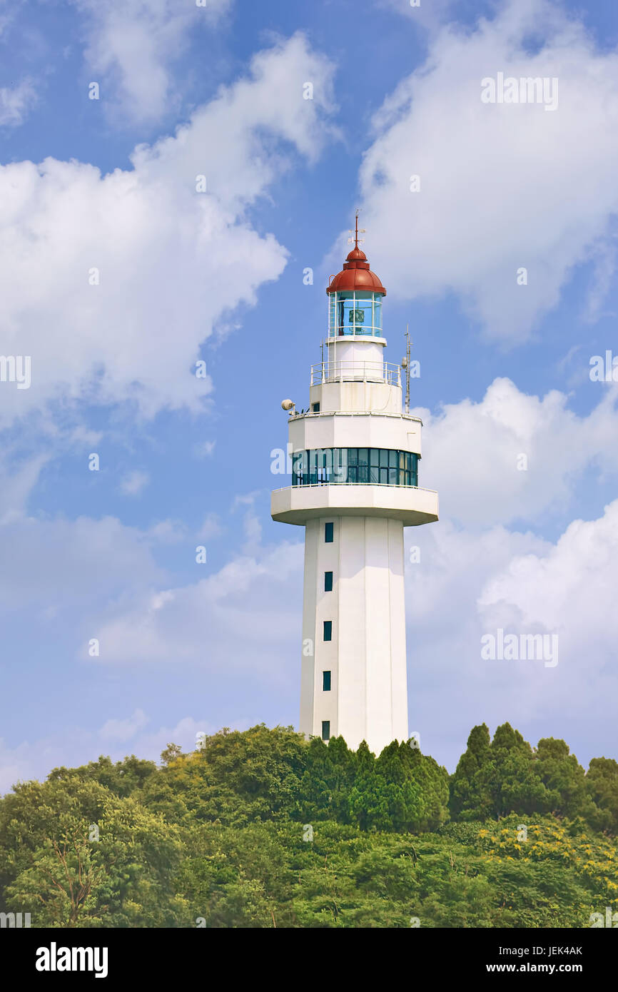 White lighthouse on a lush green hill, Yantai, China Stock Photo - Alamy