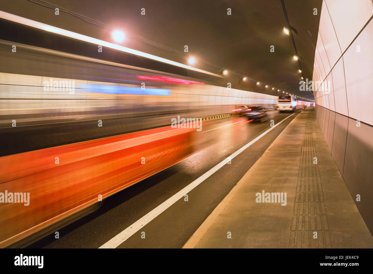 Traffic rushing trough a tunnel Stock Photo - Alamy