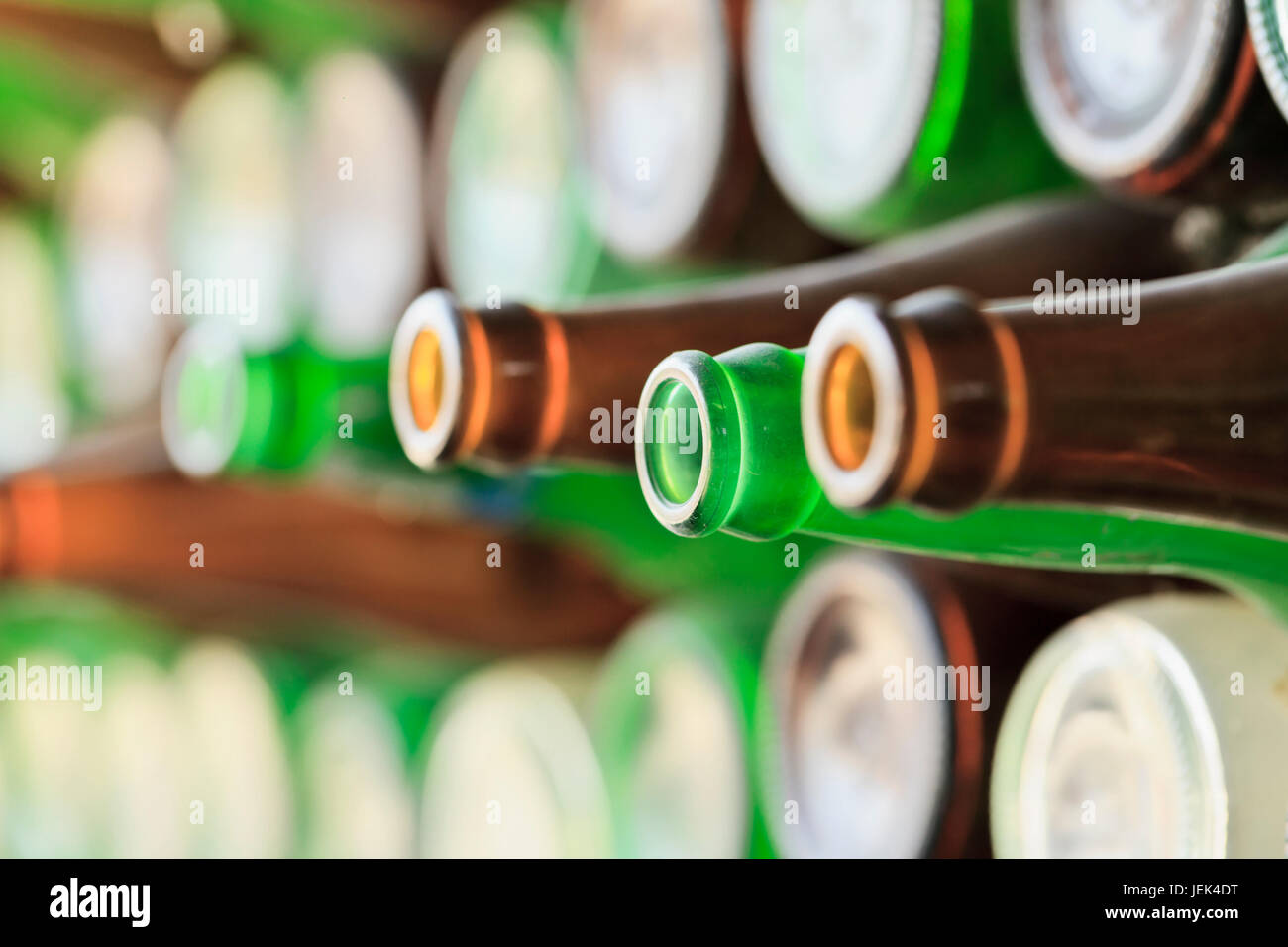 Play of light, reflection and transparency on a wall of empty beer ...