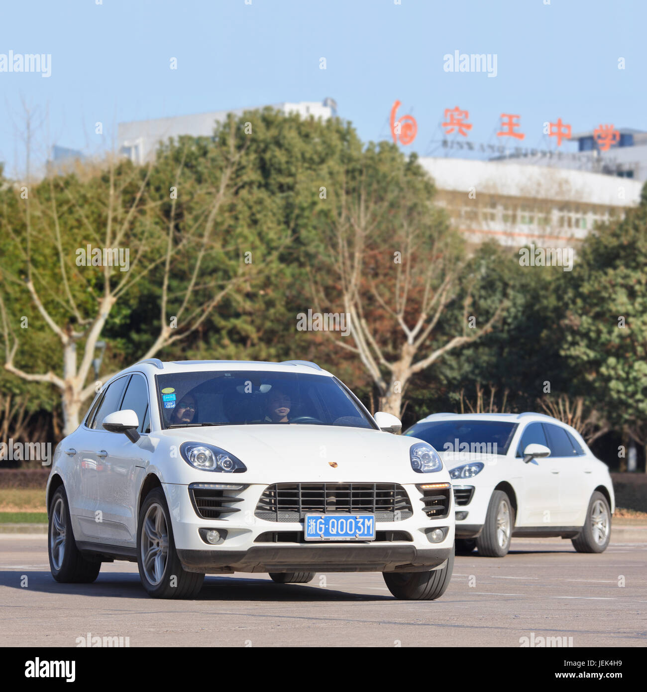 White Porsche Macan. It is 42% cheaper than the Cayenne, pushes growth ...