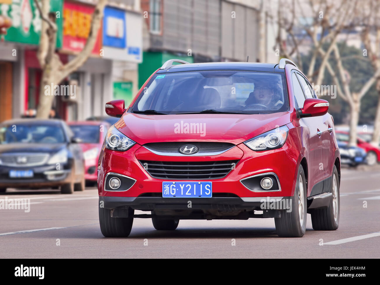 Red Hyundai IX 35 SUV on the street. Hyundai car sales in China ...