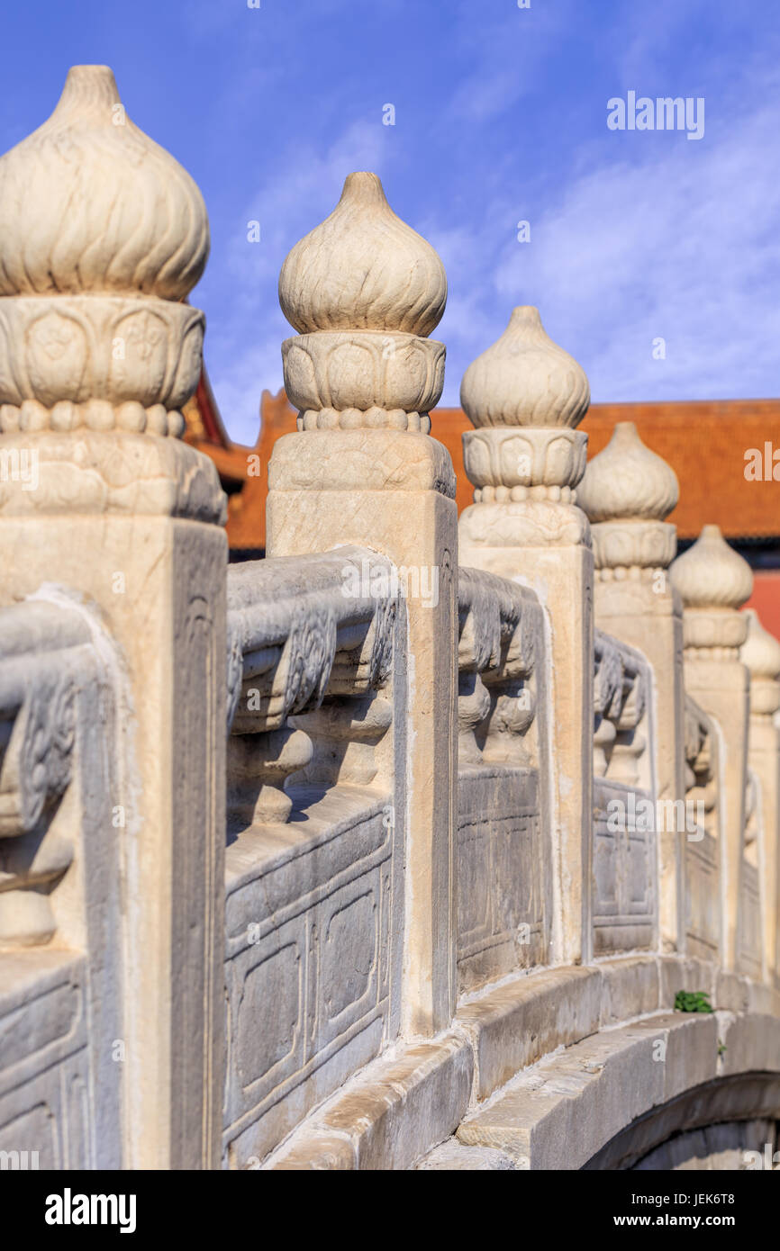 Ornate balustrade with ancient traditional building on background ...