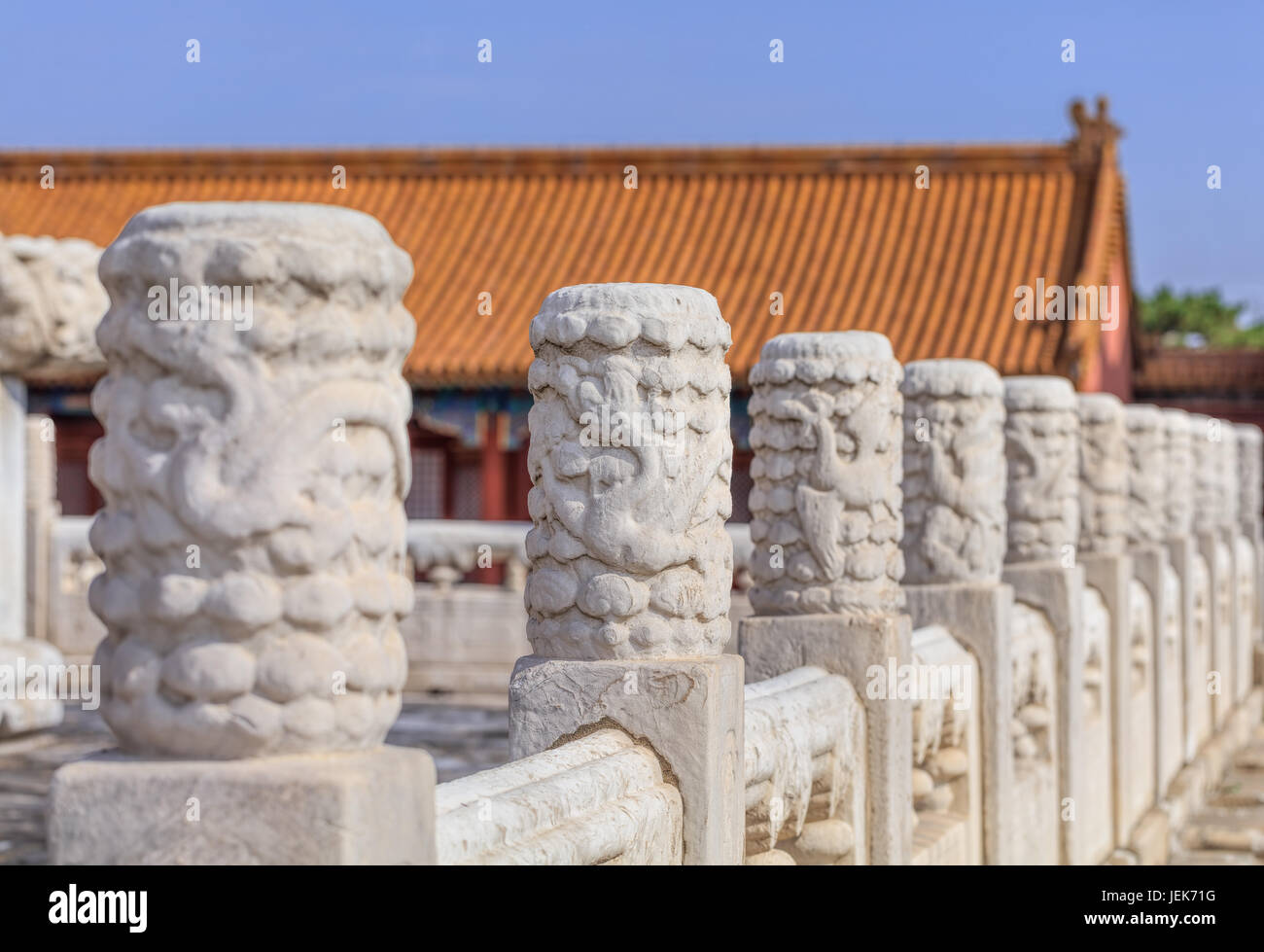 Ornate balustrade with ancient traditional building on background ...