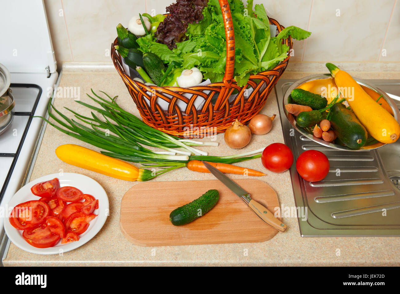 kitchen interior with vegetables and fresh greens in basket, healthy ...