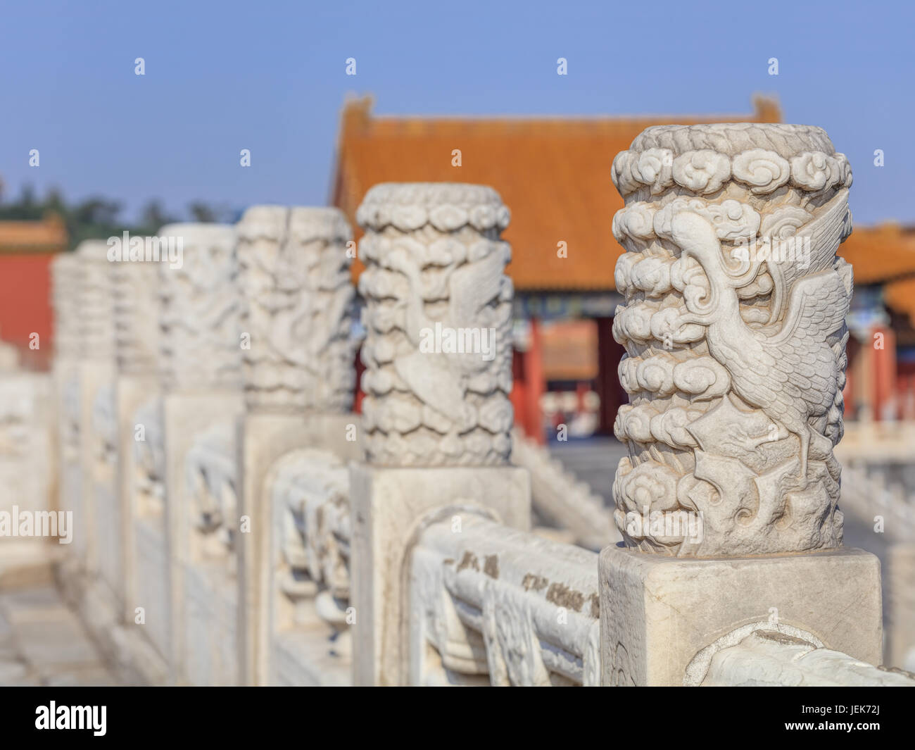 Ornate balustrade with ancient traditional building on background ...