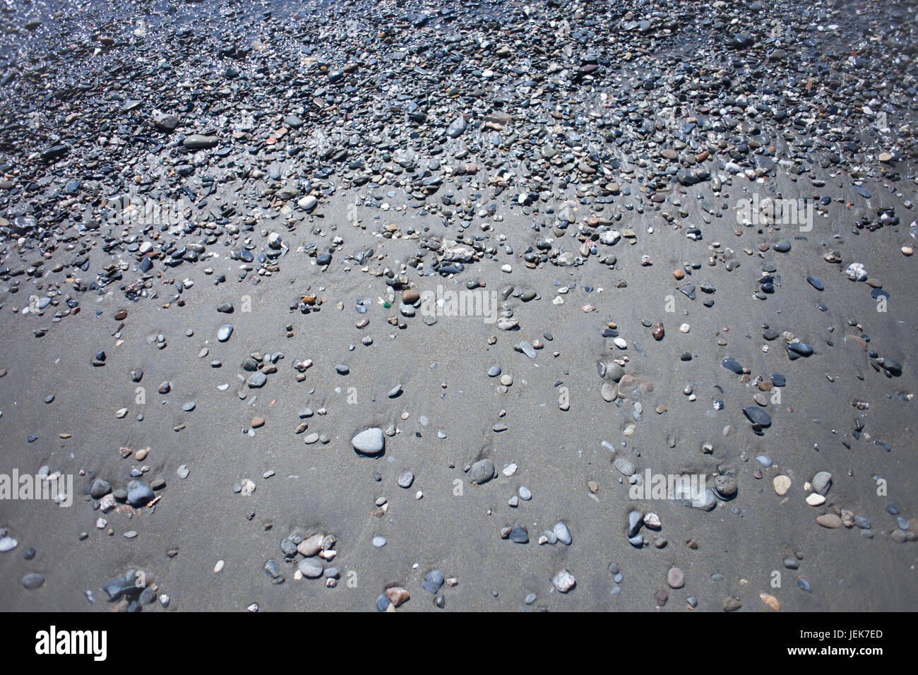 Pebbles on sandy beach hi-res stock photography and images - Alamy