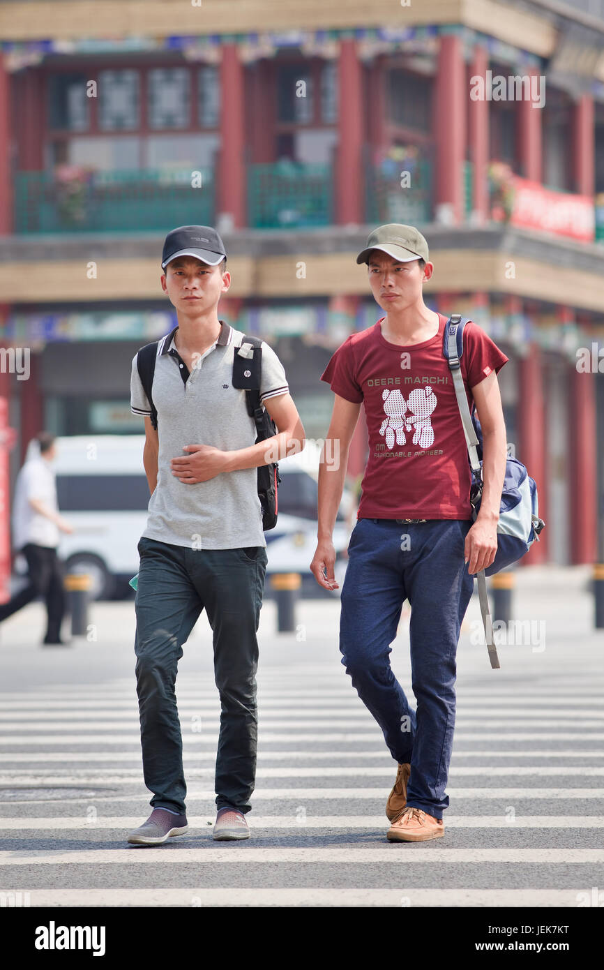 BEIJING-JUNE 9, 2015. Two young Chinese men. China faces a growing ...