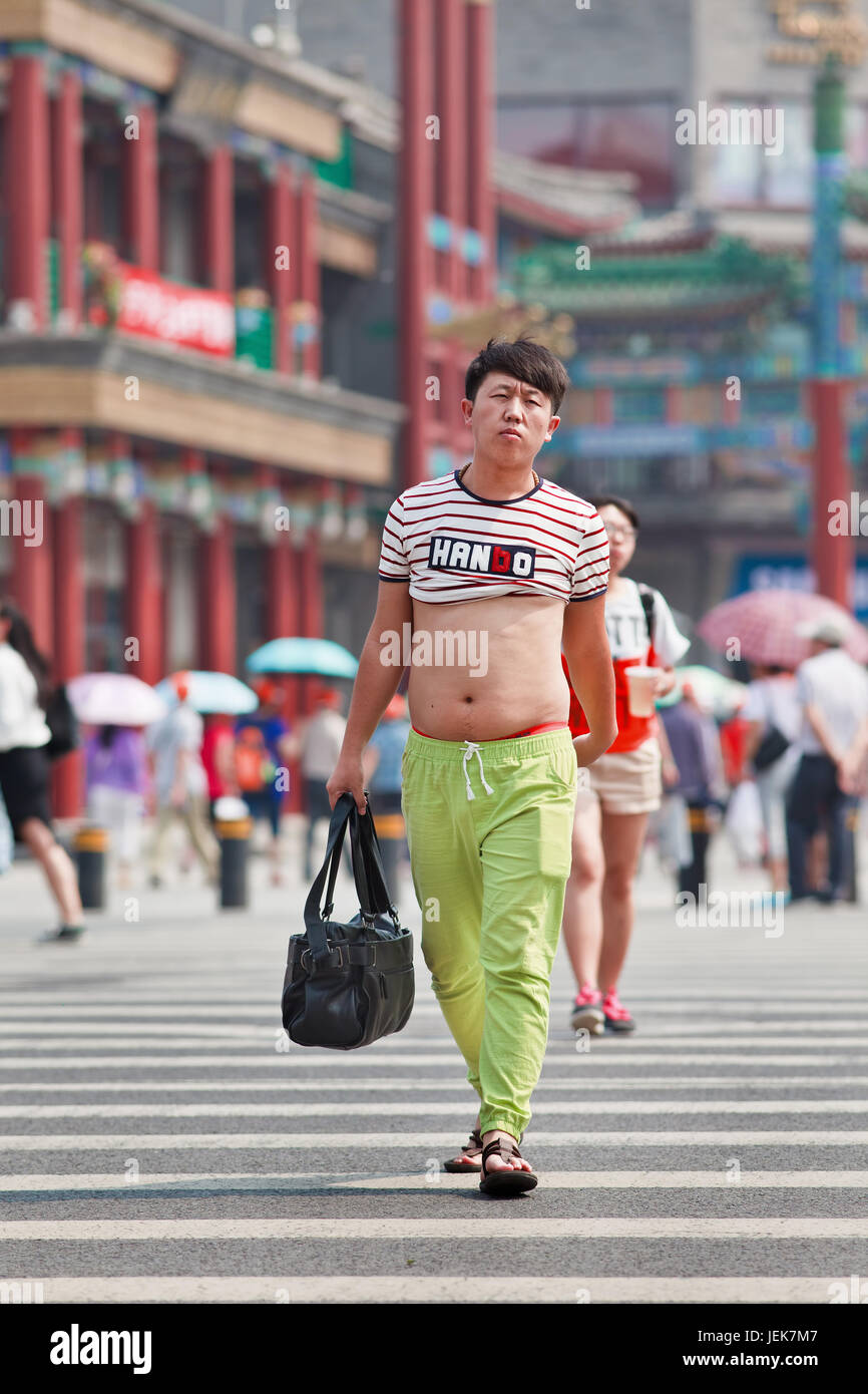 BEIJING-JUNE 9, 2015. Young man with fat belly. China’s obesity rate ...