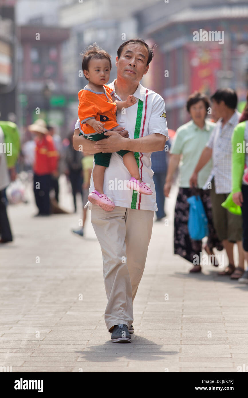 BEIJING-JUNE 9, 2015. Chinese father with child. China’s one-child ...