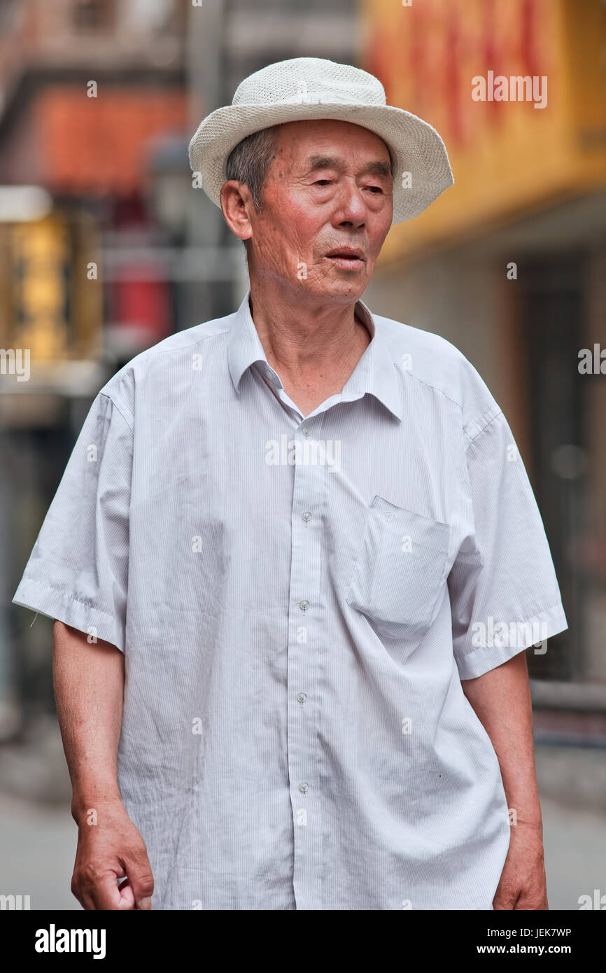 BEIJING-JUNE 9, 2015. Chinese senior in city center. Elderly population ...