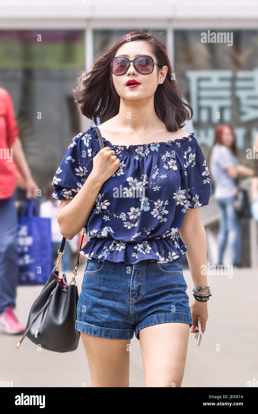 BEIJING-MAY 4, 2106. Fashionable girl Beijing downtown. Chinese ...