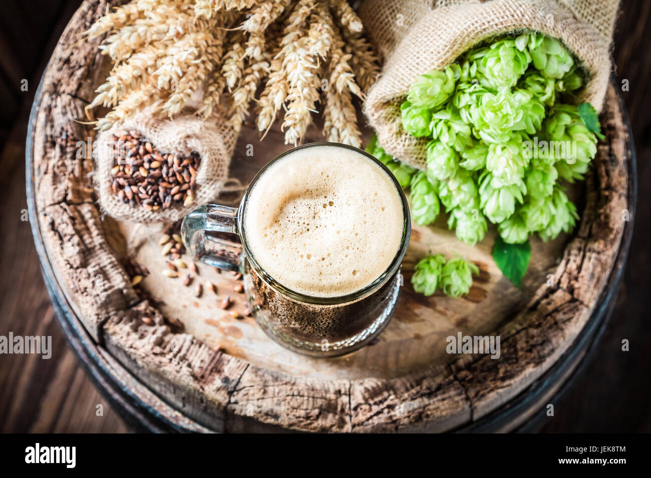 Top view of dark beer on old oak barrel Stock Photo - Alamy