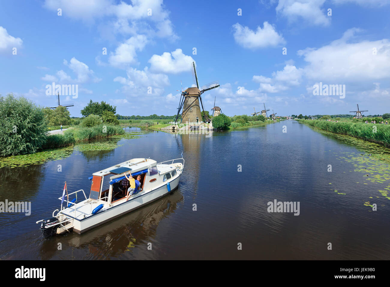 KINDERDIJK-HOLLAND-AUG. 11. Boat in canal in Kinderdijk, a village ...