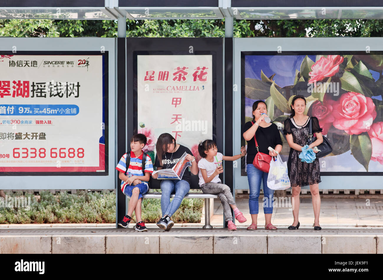Chinese woman waiting bus stop hi-res stock photography and images - Alamy