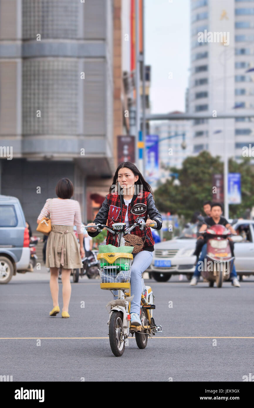 Girl riding bike china hi-res stock photography and images - Alamy