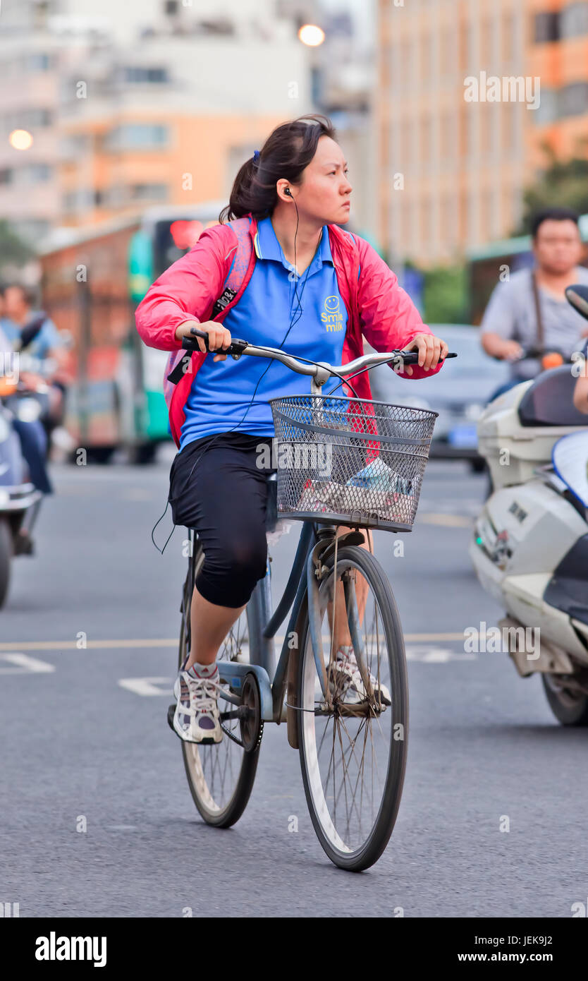 Woman cycles china hi-res stock photography and images - Alamy