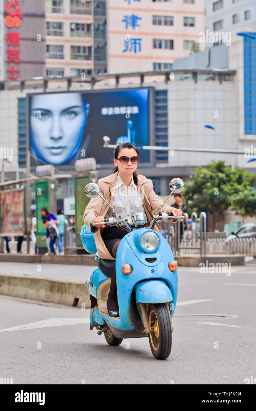 Girl bike street scene china hi-res stock photography and images - Alamy
