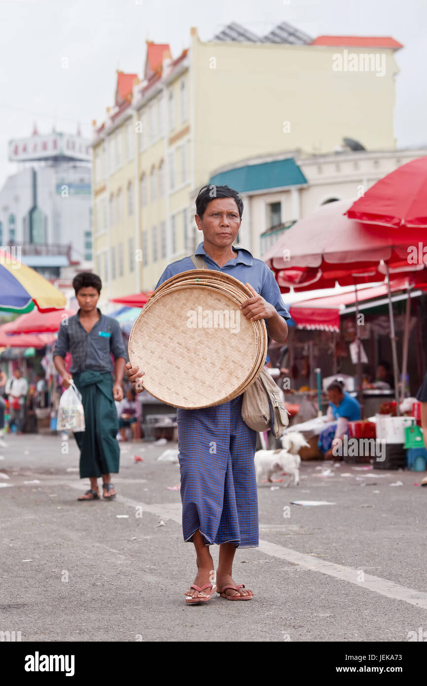 RUILI-CHINA-JUNE 28, 2014. Tanned man on local market. Ruili is on the ...