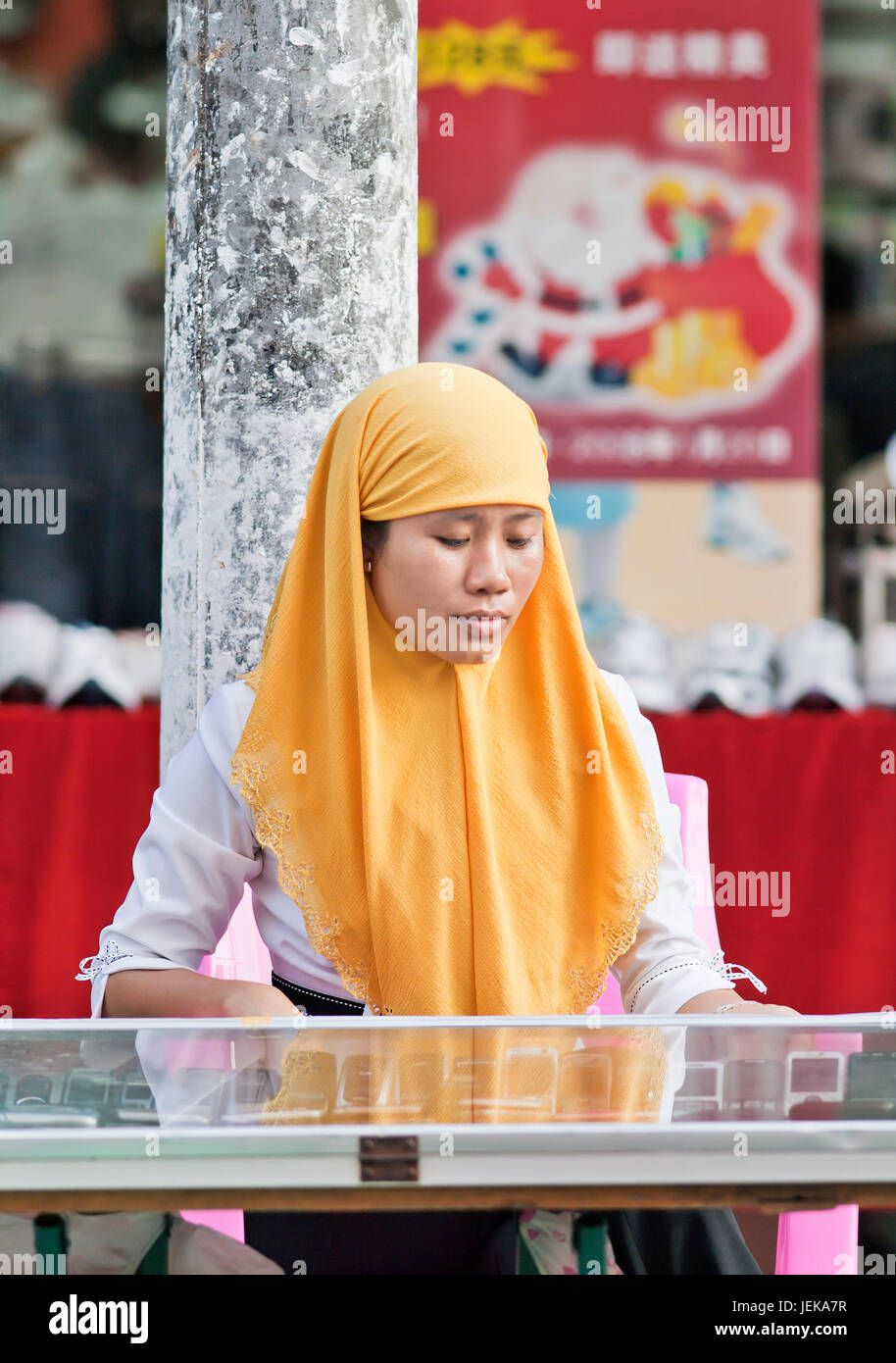 SANYA-JAN. 12, 2008. Hui muslim female vendor. 20,000 Hui muslims live ...