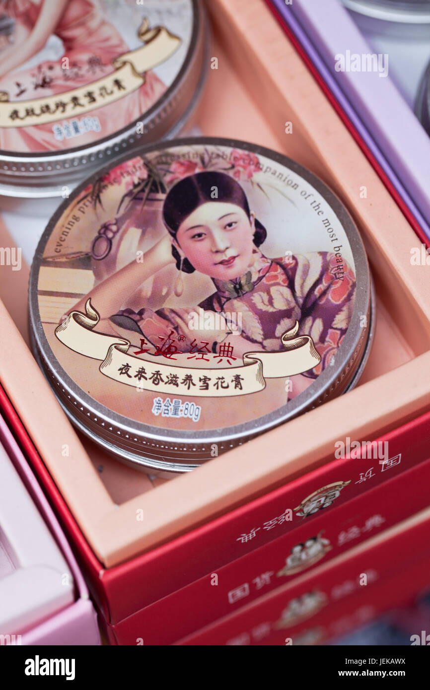 Skin cream in a traditional packaging. A porcelain pale skin is the ...