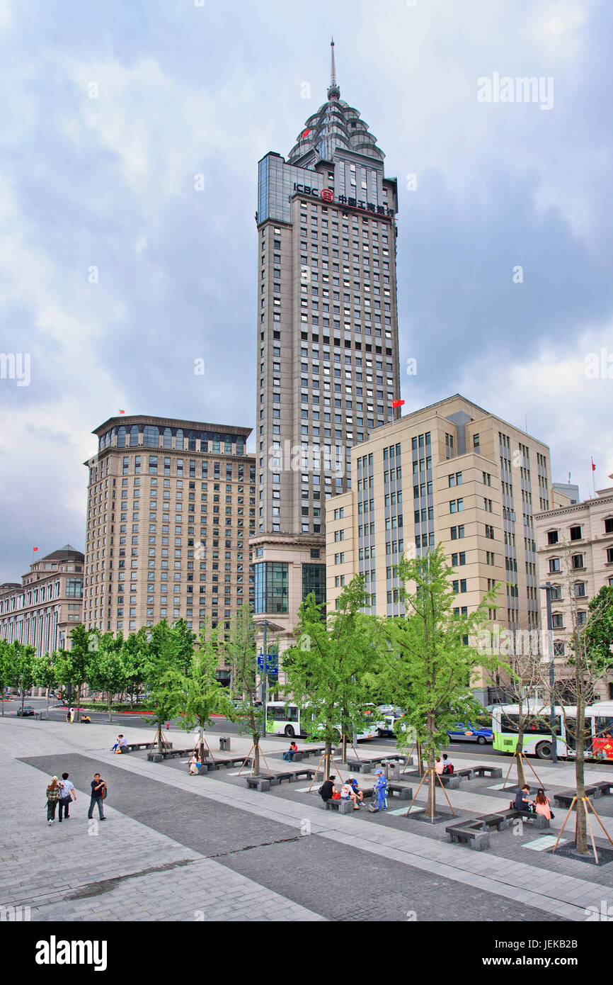 People sit and walk at the Bund. The Bund has dozens of historical ...