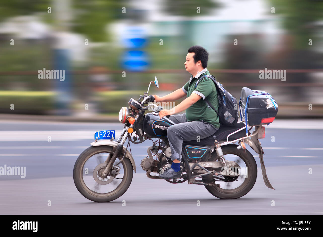 Man on Wonjan motorcycle. With annual production of 500,000 motorcycles ...