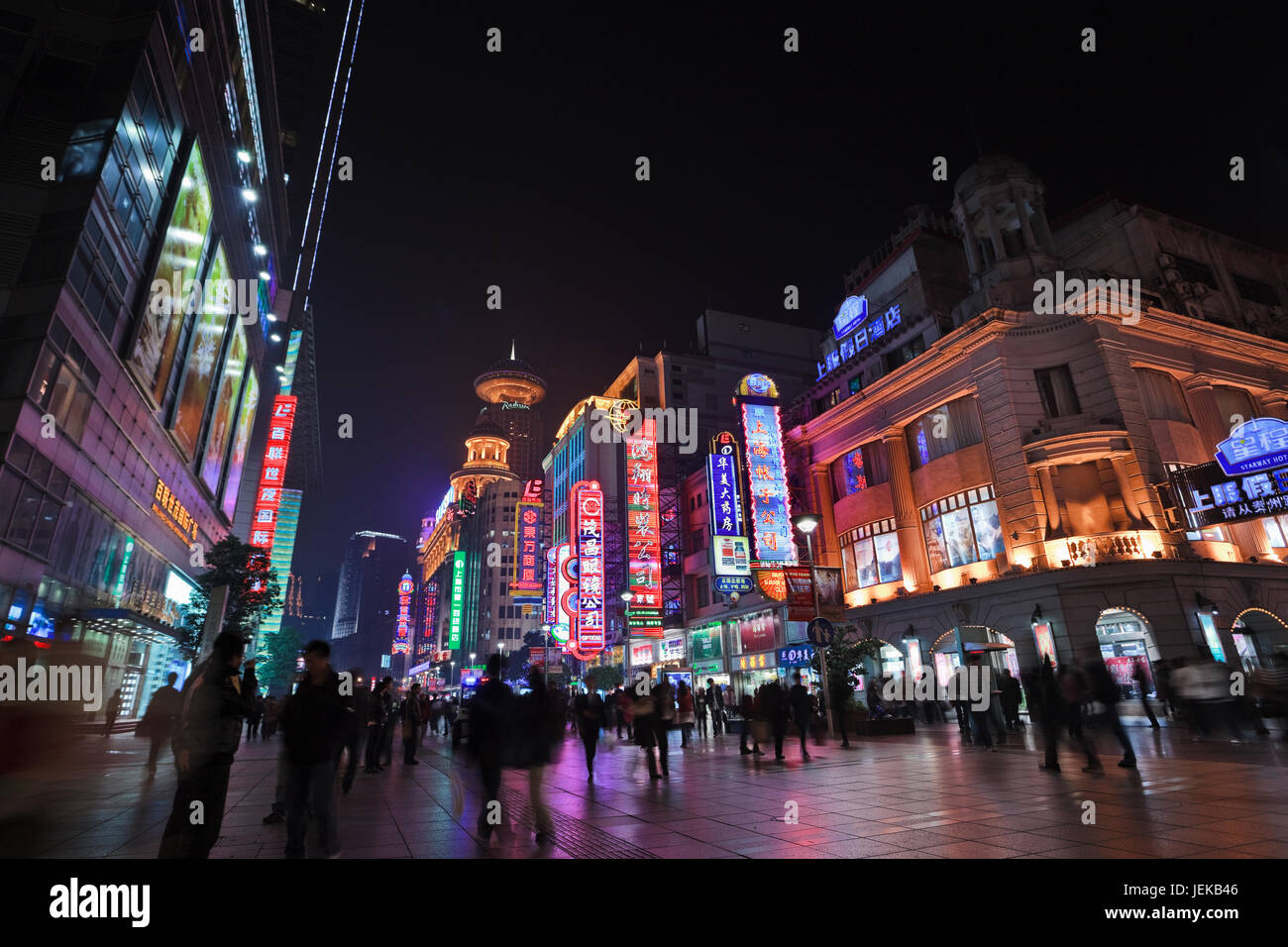 Nanjing East Road in Shanghai at night. Nanjing East Road is one of the ...